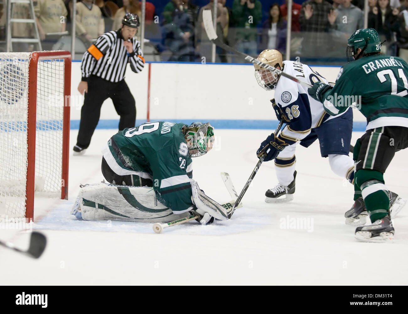 Michigan State Defenseman Matt Crandell (21), Goaltender Drew Palmisano ...