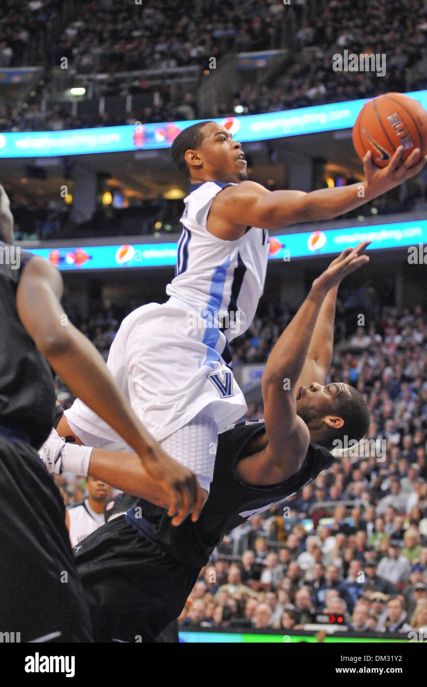 Villanova guard Corey Fisher #10 drives to the hoop for two and a foul ...