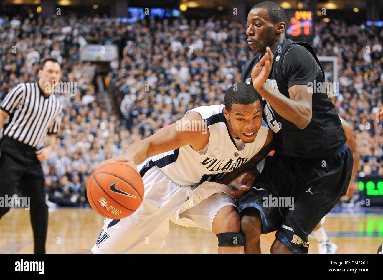 Villanova guard Corey Fisher #10 drives into Georgetown forward Julian ...