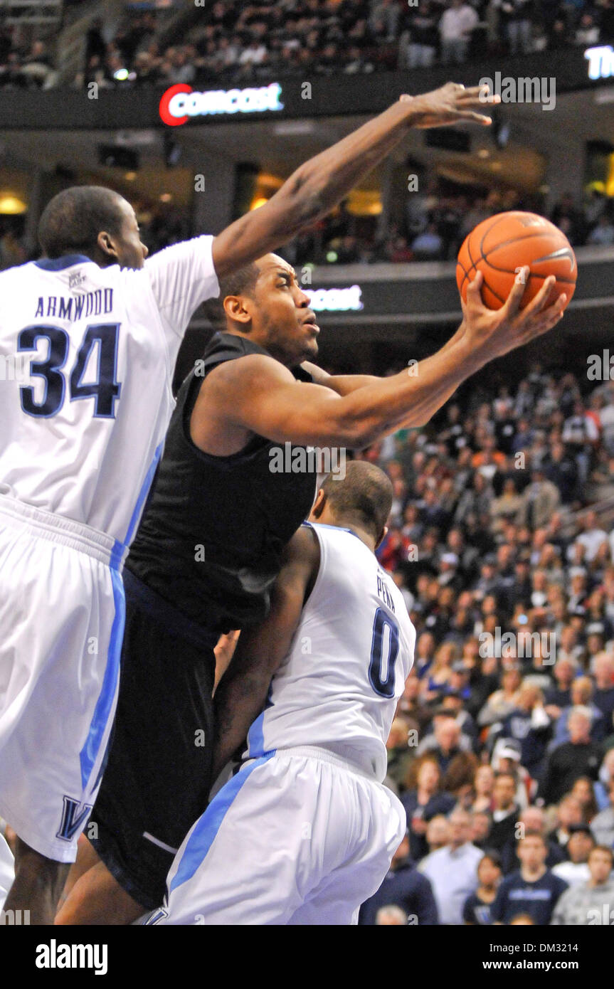 Georgetown guard Austin Freeman #15 splits Villanova forward Isaiah ...