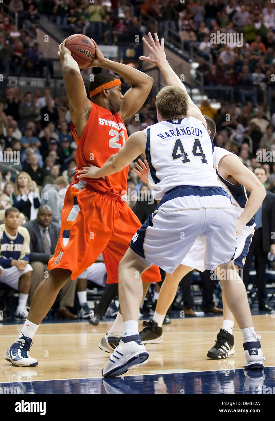 Notre Dame Forward Luke Harangody (44) defends Syracuse Forward Arinze ...