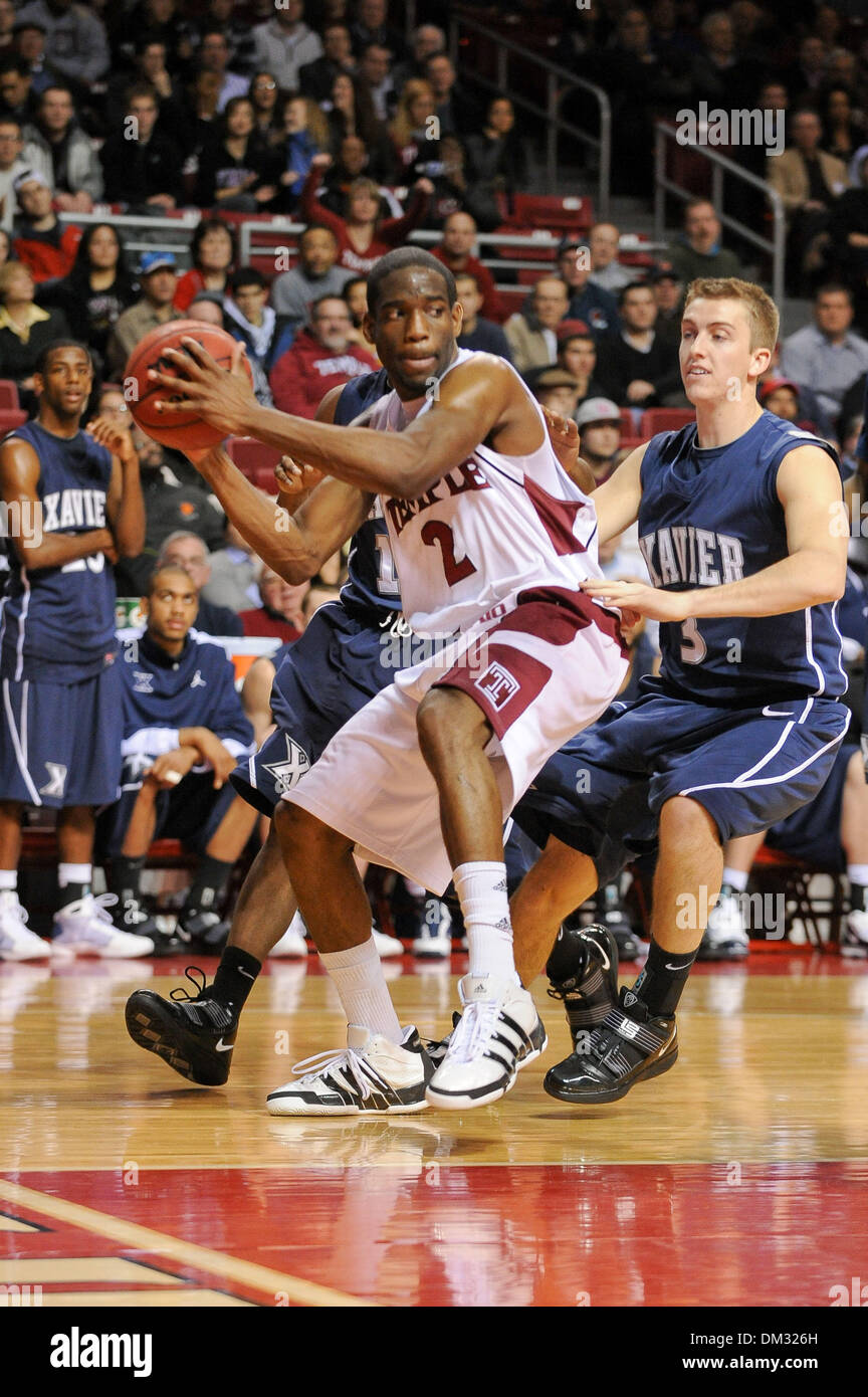 Temple guard Ryan Brooks #2 controls the rebound while being guarded by ...