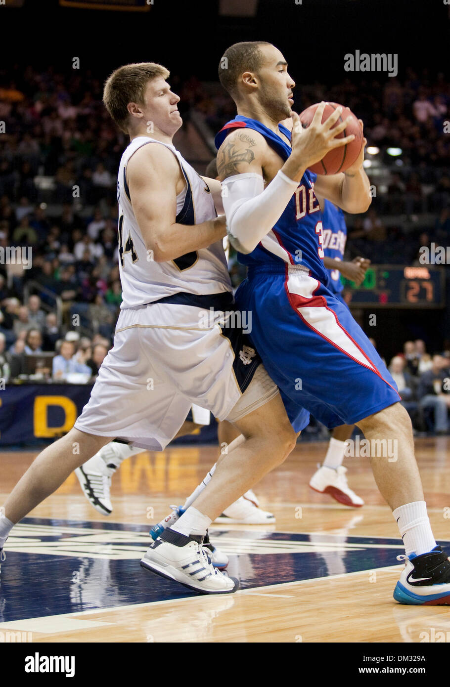 DePaul Center Krys Faber (33) and Notre Dame Forward Luke Harangody (44 ...