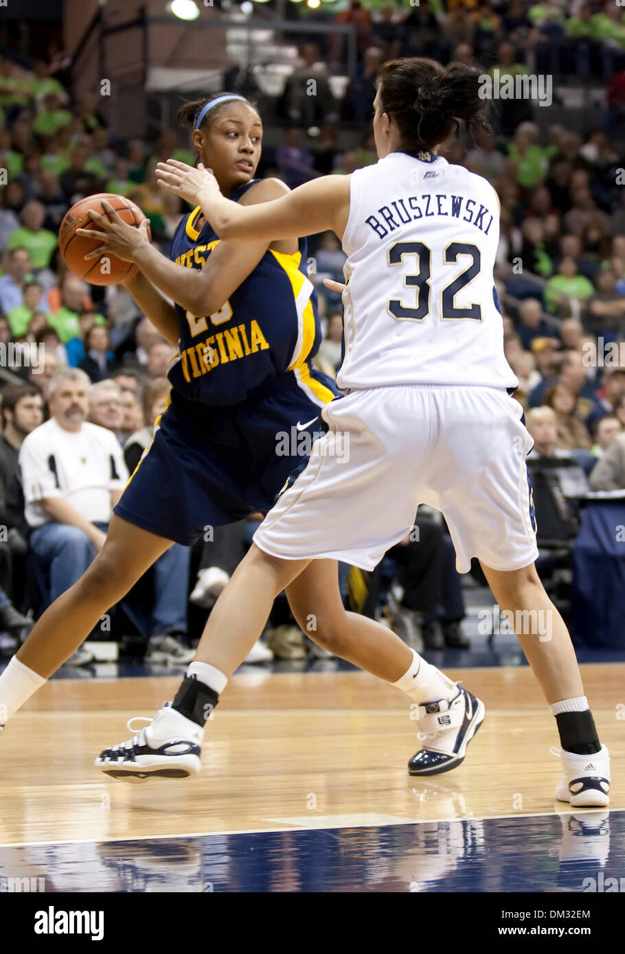 West Virginia Center Asya Bussie (20) and Notre Dame Forward Becca ...