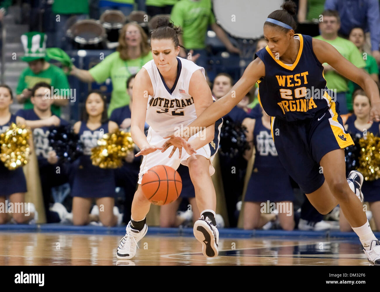 West Virginia Center Asya Bussie (20) and Notre Dame Forward Becca ...