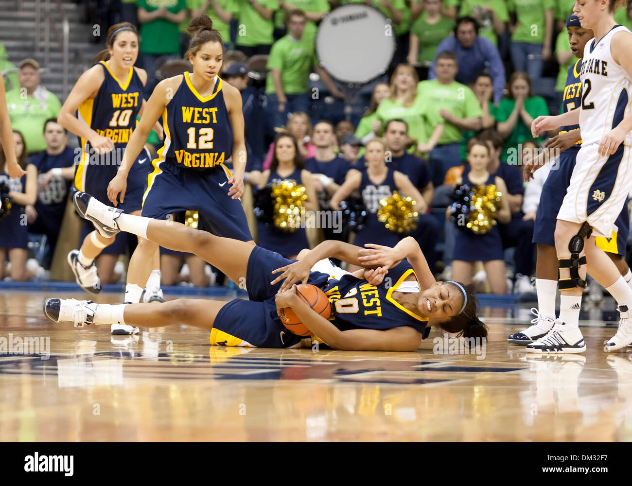 West Virginia Center Asya Bussie (20) dives for loose ball with Notre ...