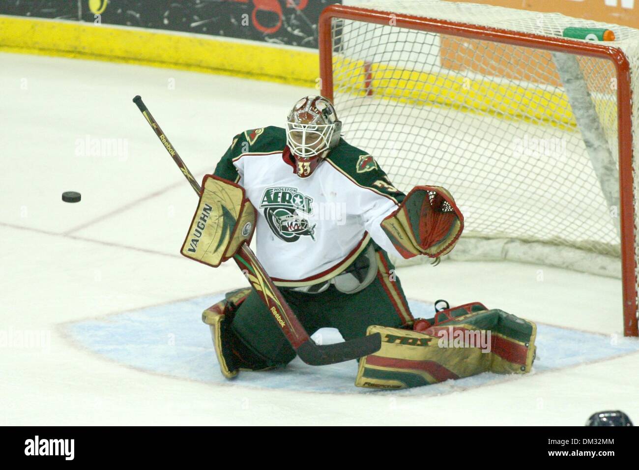 Houston Aeros Goalie Barry Brust (33) makes a glove save on this shot ...