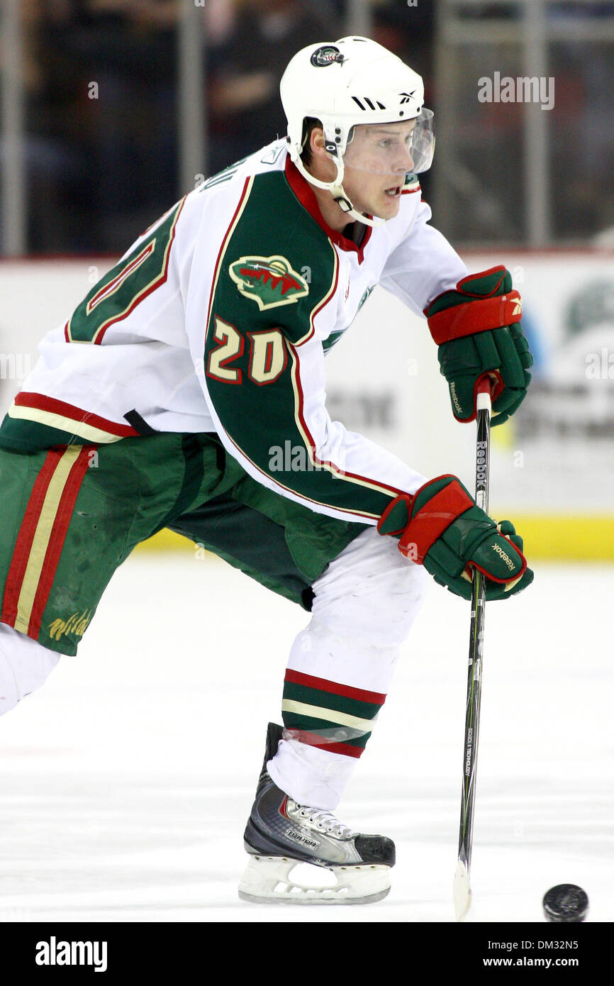 Houston Aeros Center Chad Rau (20) brings the puck ice to the Griffins ...