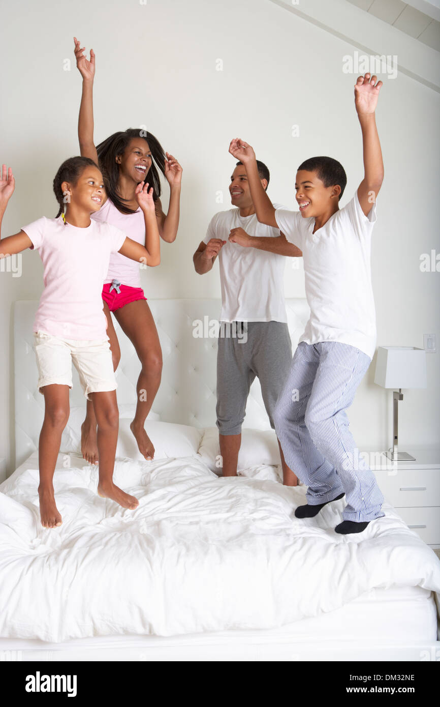 Black children jumping on bed hi-res stock photography and images - Alamy