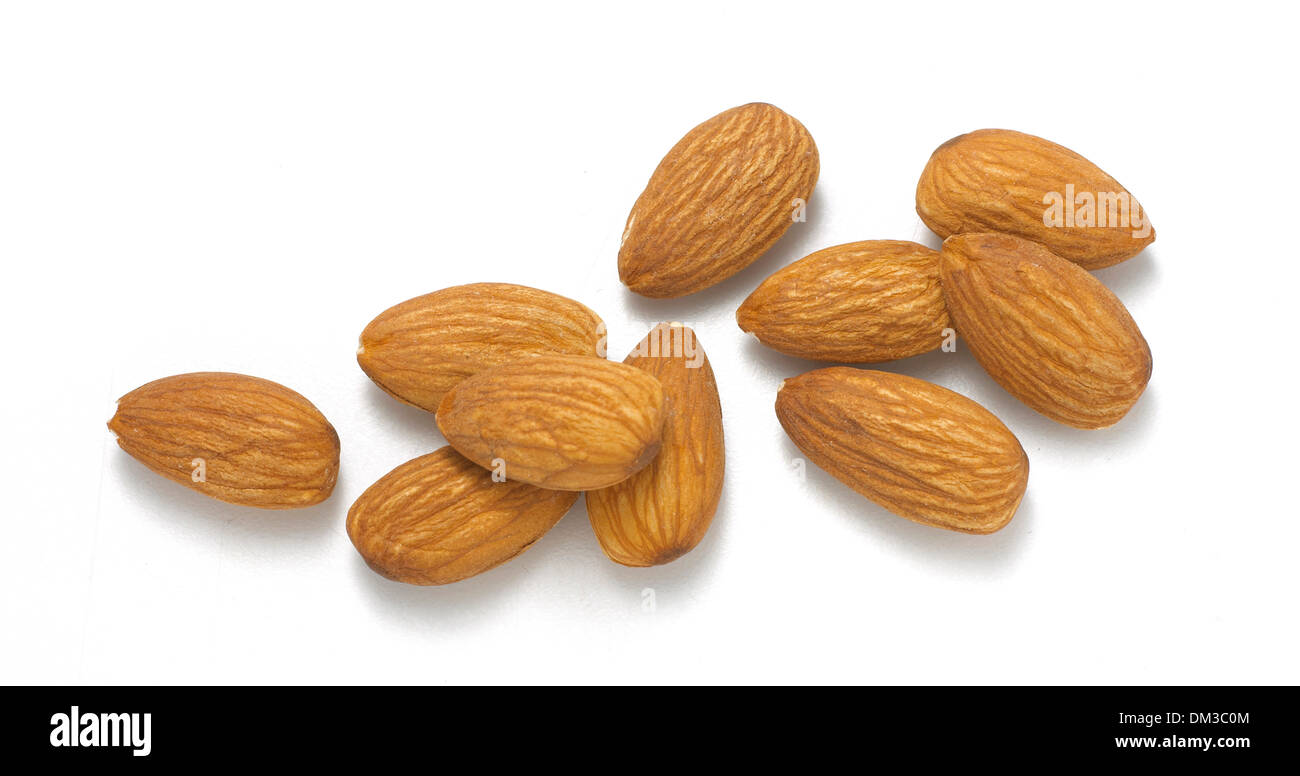 Almonds cut out on a white background Stock Photo - Alamy