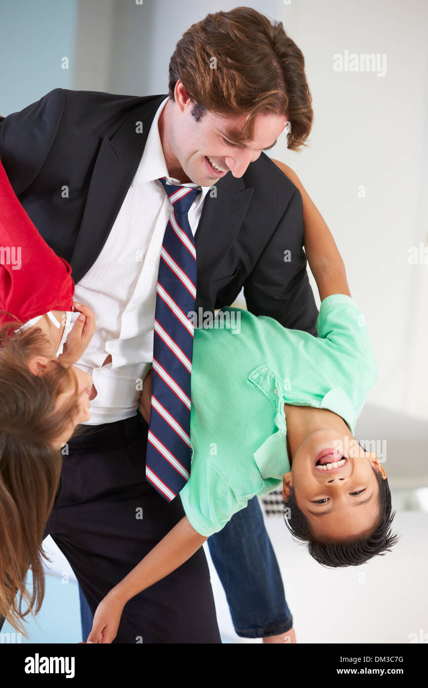 Children Greeting Father On Return From Work Stock Photo - Alamy