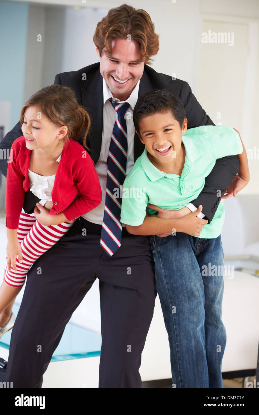 Children Greeting Father On Return From Work Stock Photo - Alamy