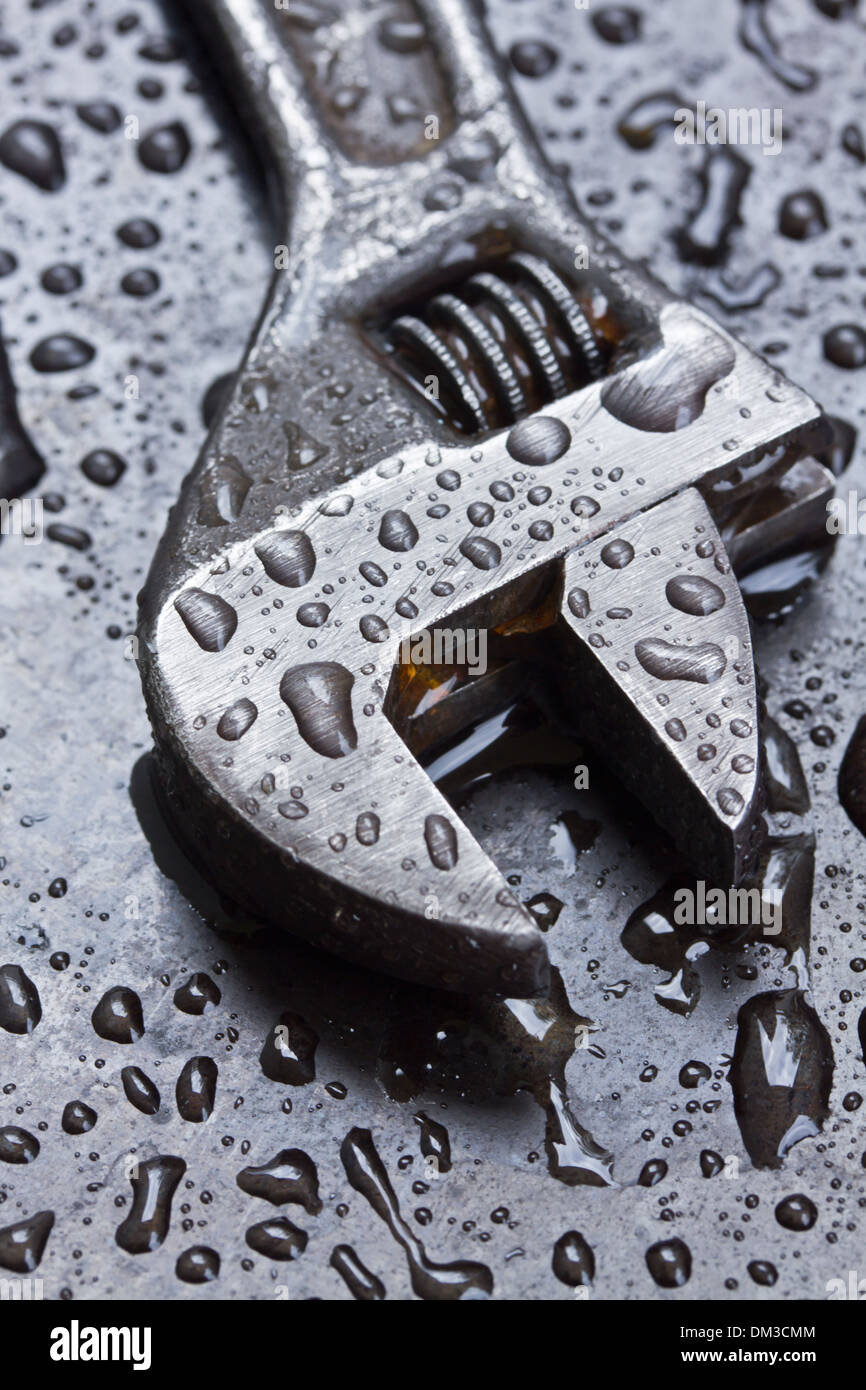 Adjustable wrench in water drops Stock Photo - Alamy