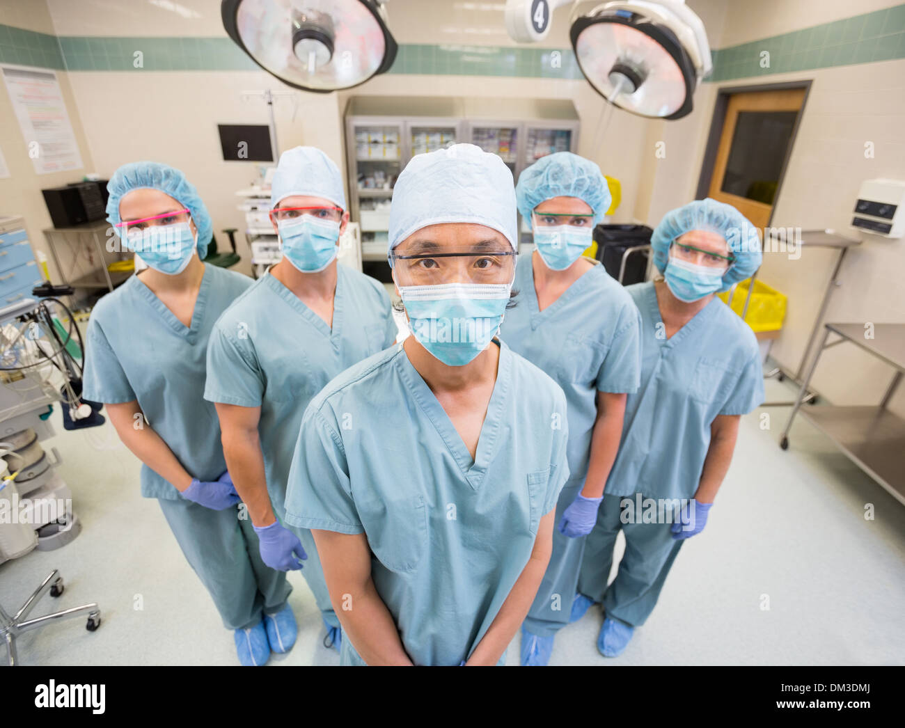 Medical Team In Scrubs Standing Inside Operation Room Stock Photo - Alamy