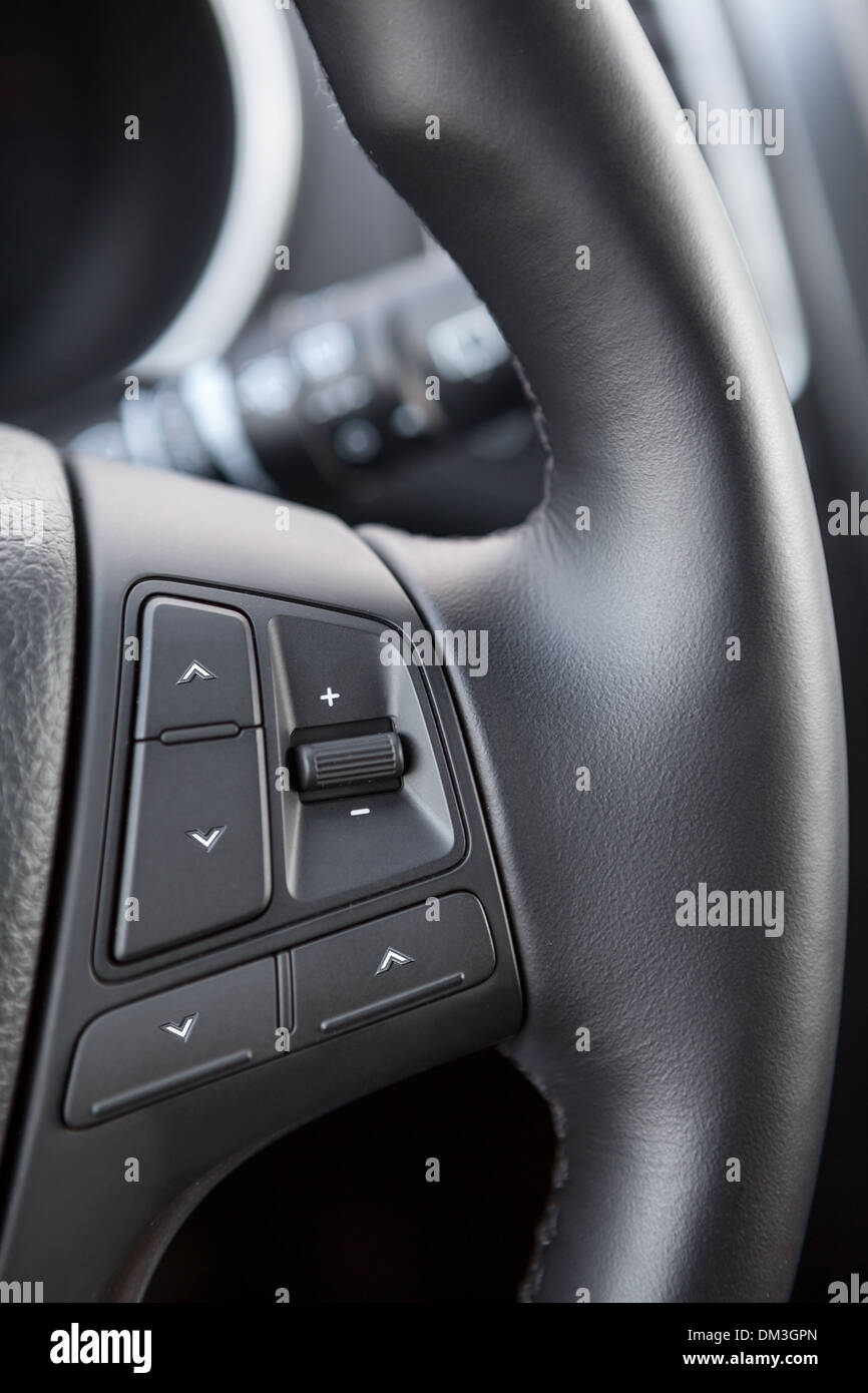 Control buttons on the steering wheel of a vehicle Stock Photo - Alamy