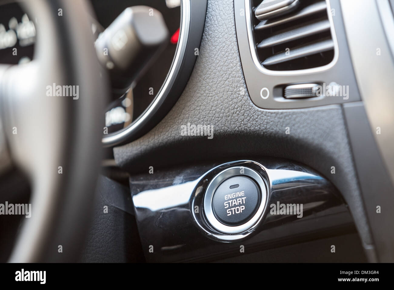 Car interior, engine start button under the steering wheel Stock Photo ...