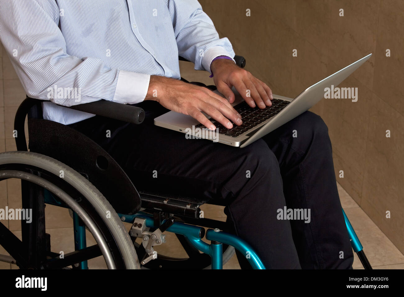 Businessman in wheelchair using computer hi-res stock photography and ...