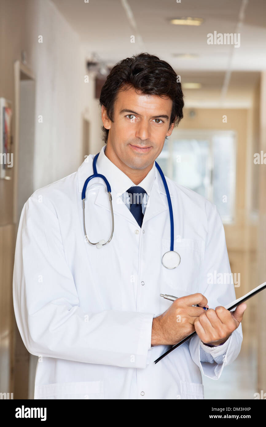 Doctor Writing Report Stock Photo - Alamy