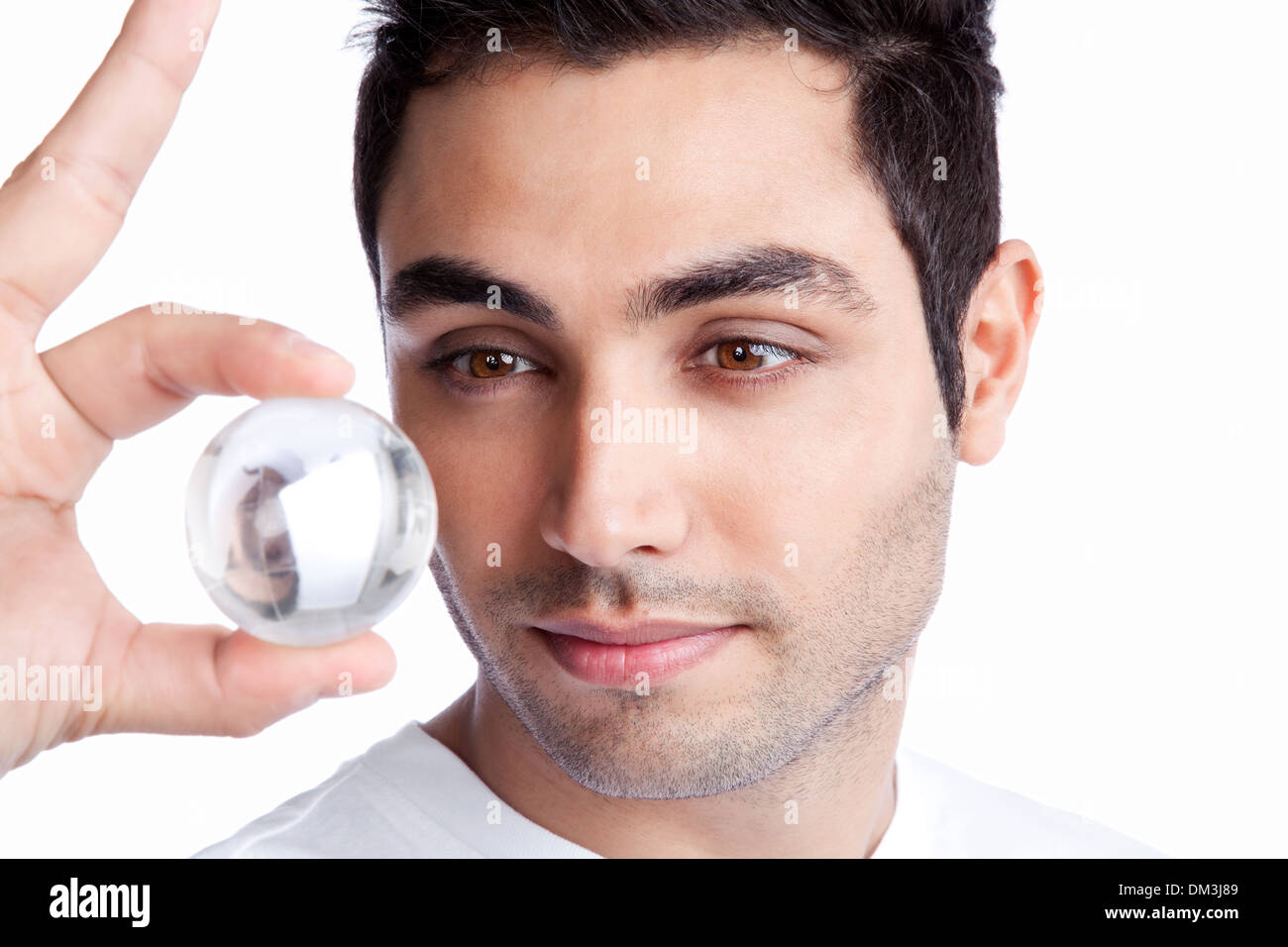 Young Man Holding Crystal Ball Stock Photo - Alamy