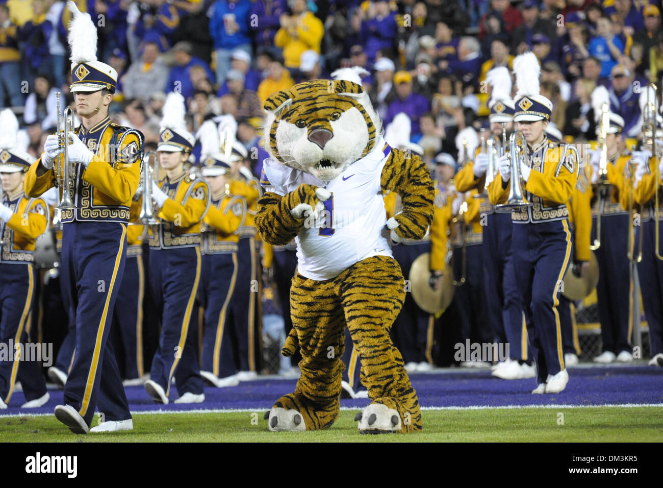 LSU mascot, Mike the Tiger, takes the field with the LSU band prior to ...