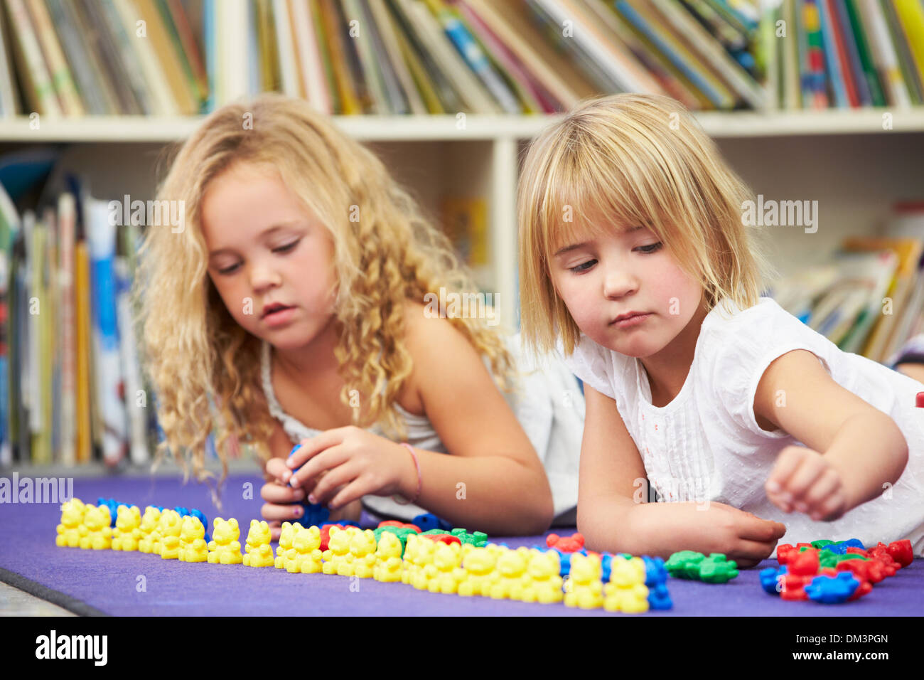 Two Elementary Pupils Counting Together In Classroom Stock Photo - Alamy