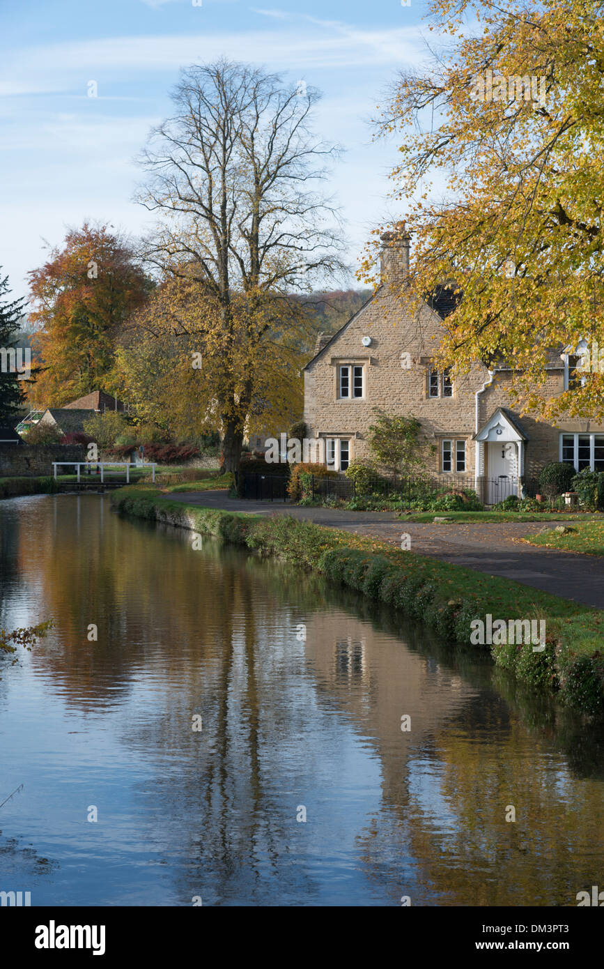 A pretty limestone house by the River Eye in Lower Slaughter in the ...