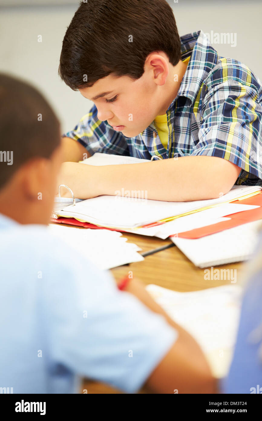 Pupils Studying At Desks In Classroom Stock Photo - Alamy