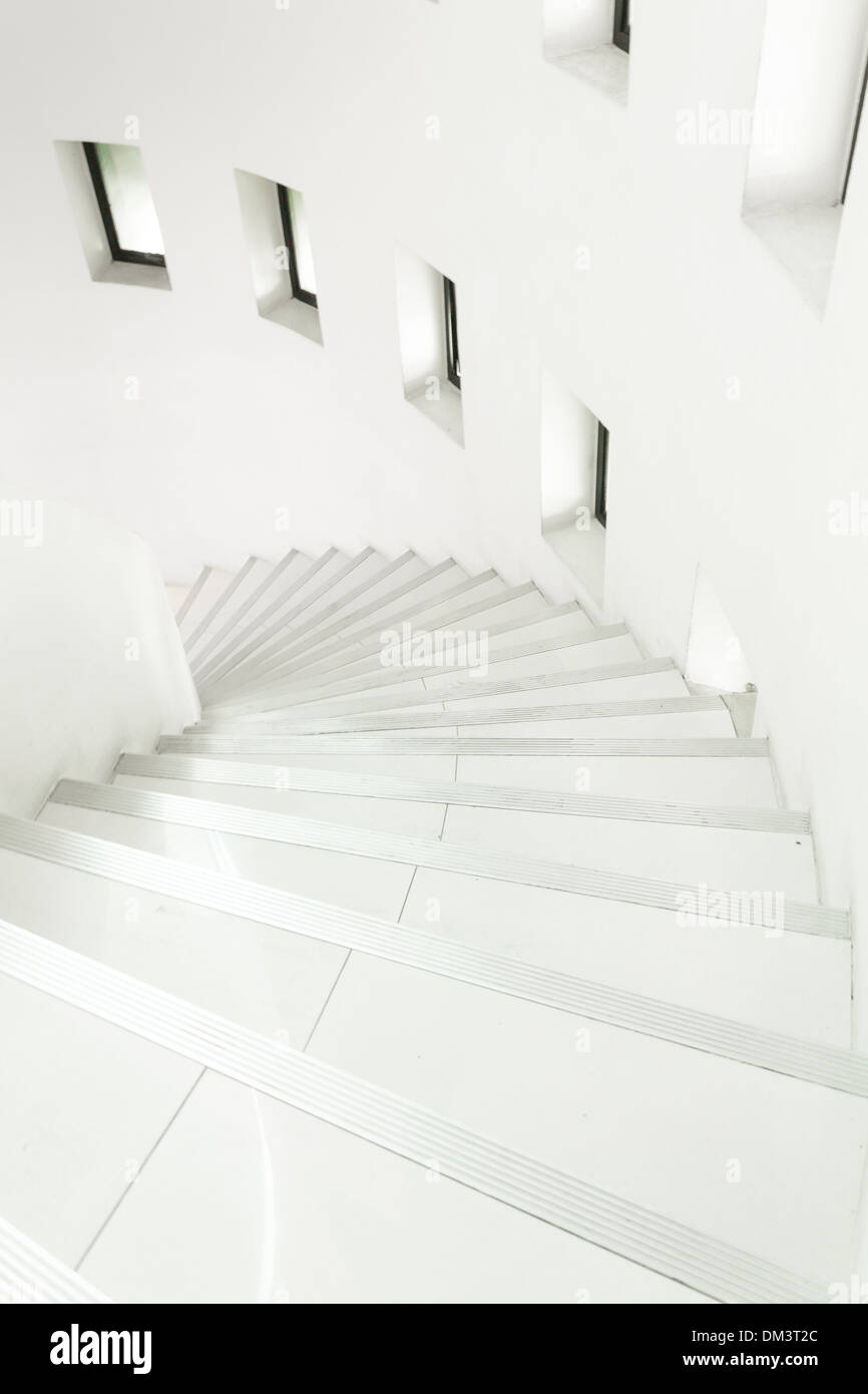 white Spiral stair concrete and window Stock Photo - Alamy