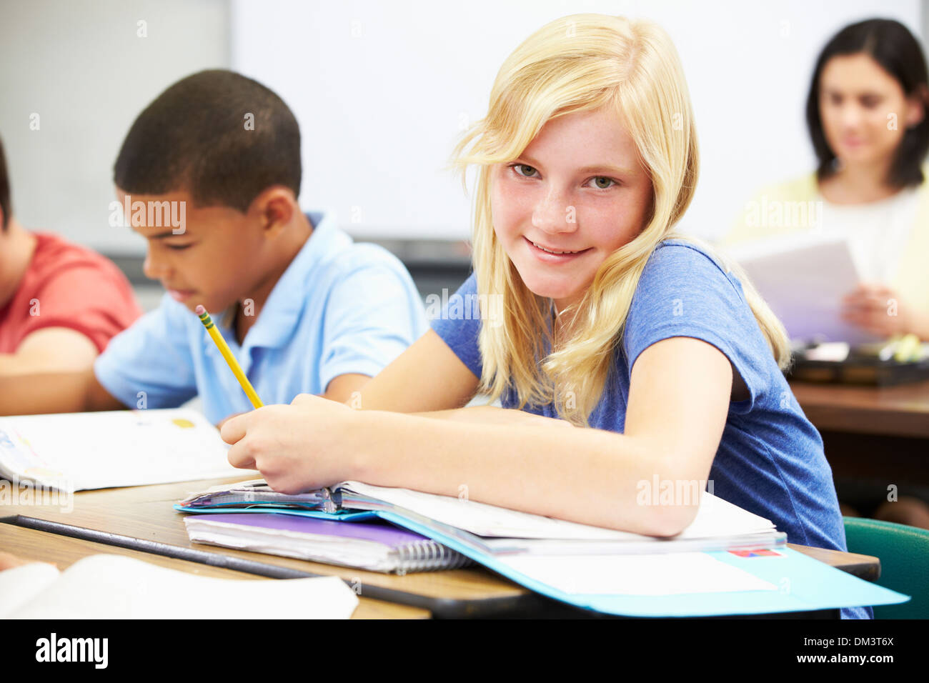 Pupils Studying At Desks In Classroom Stock Photo - Alamy