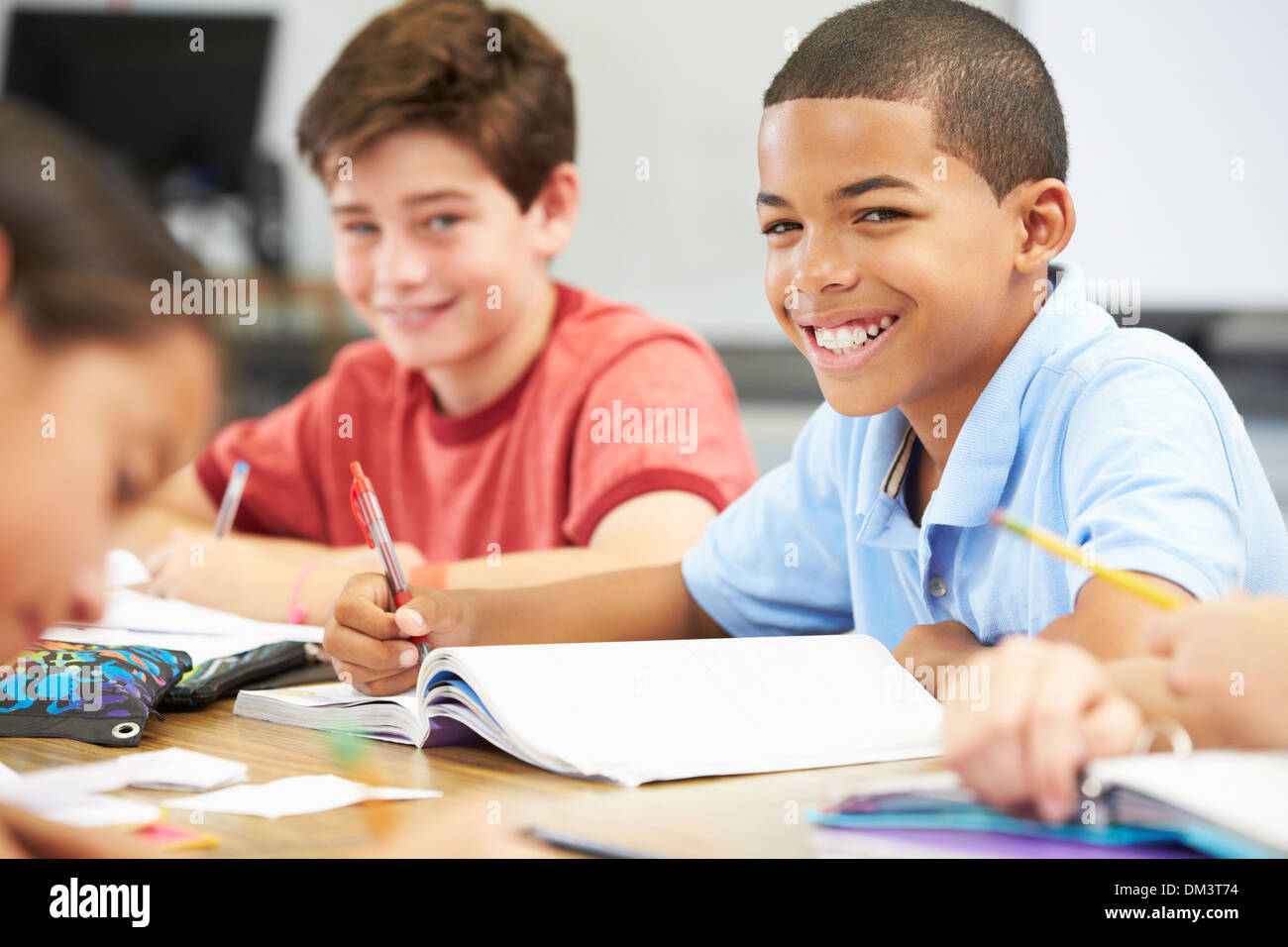 Pupils Studying At Desks In Classroom Stock Photo - Alamy