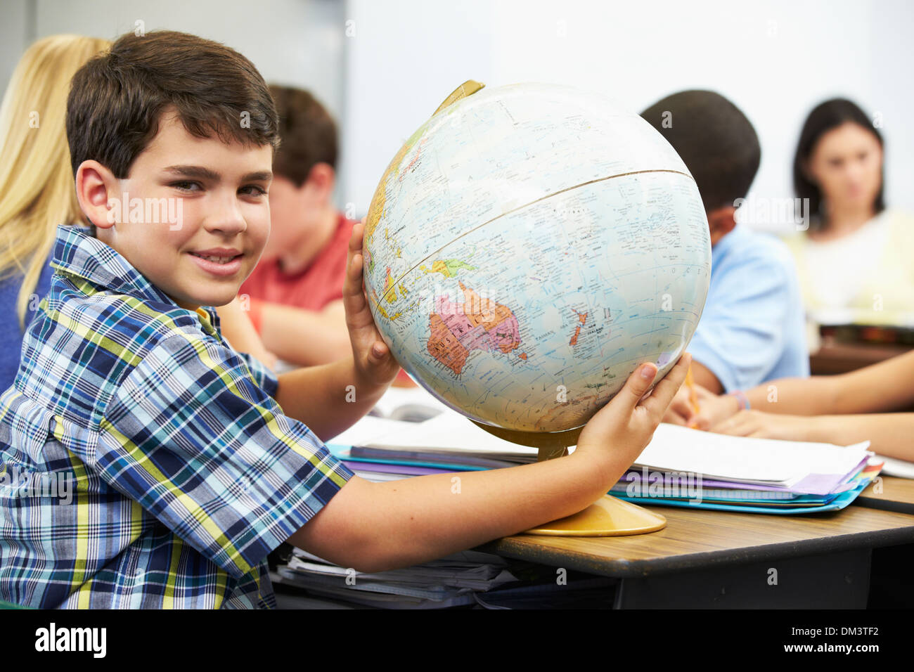 Pupils Studying Geography In Classroom Stock Photo - Alamy