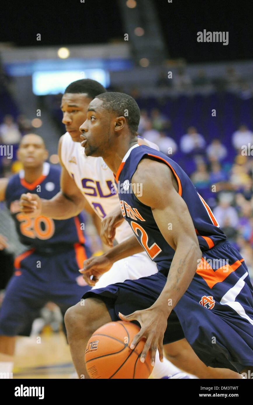 Auburn guard, #12 DeWayne Reed, drives past LSU guard, #4 Chris Bass ...
