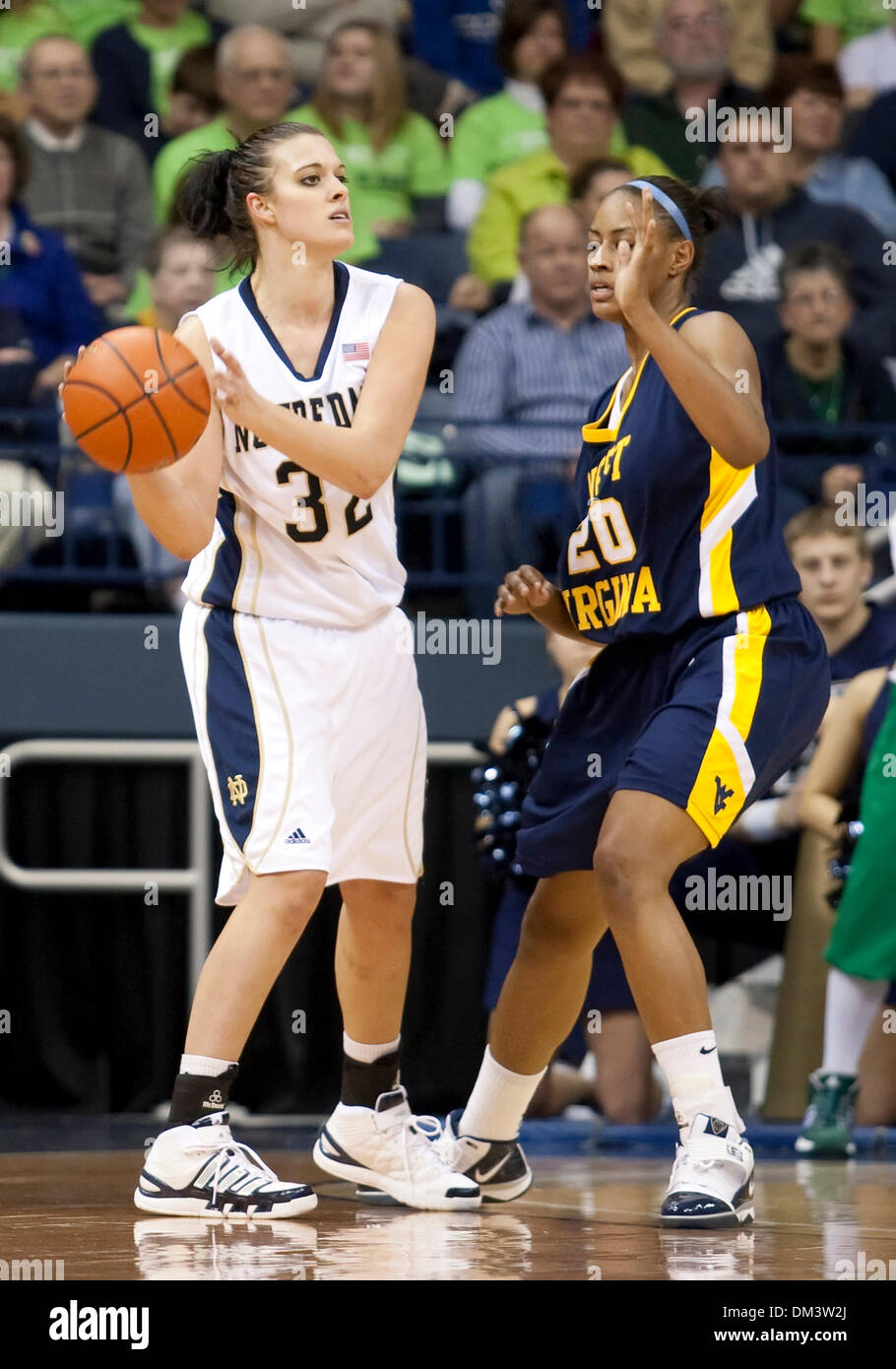 West Virginia Center Asya Bussie (20) and Notre Dame Forward Becca ...