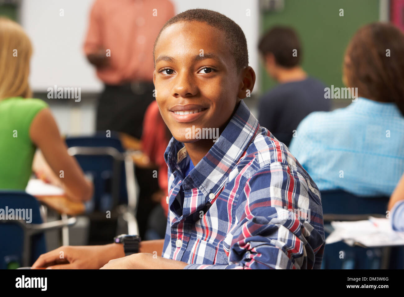 Male Teenage Pupil In Classroom Stock Photo - Alamy