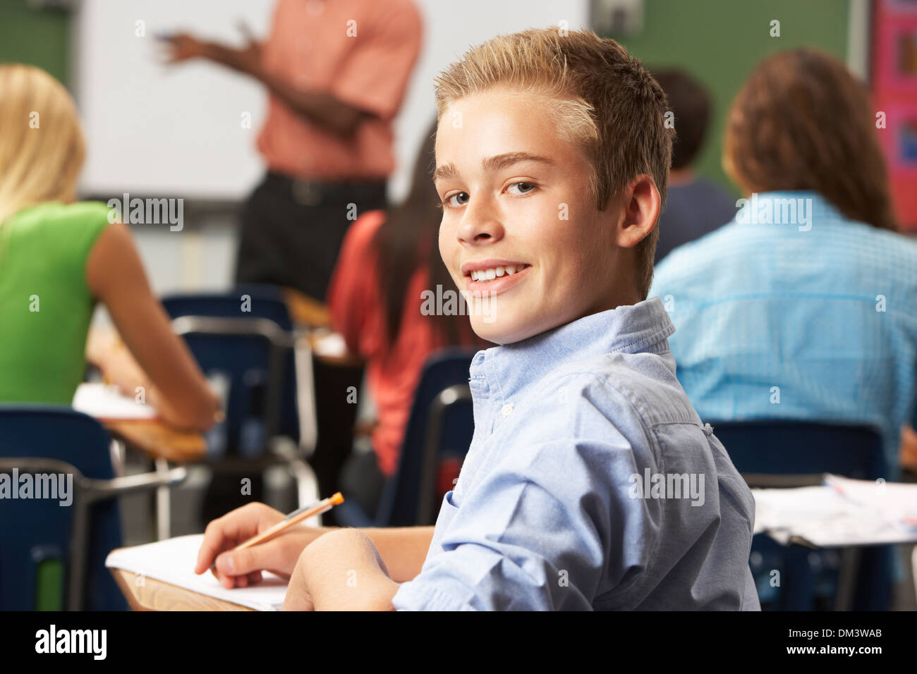 Male Teenage Pupil In Classroom Stock Photo - Alamy