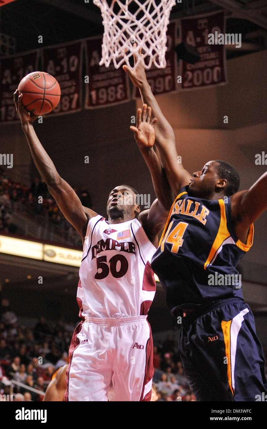 Temple forward/center Micheal Eric #50 goes to the basket while being ...