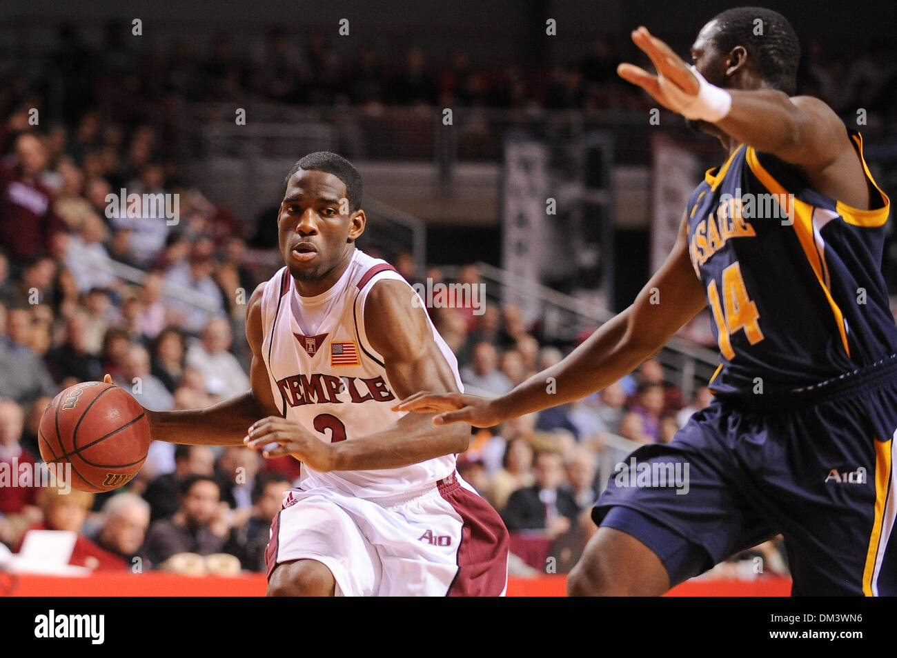 Temple guard Ryan Brooks #2 drives the lane while being guarded by La ...