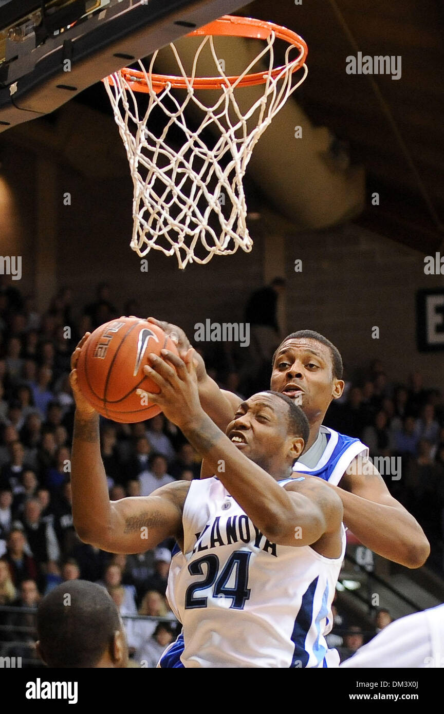 Villanova guard Corey Stokes #24 drives to the basket while being ...