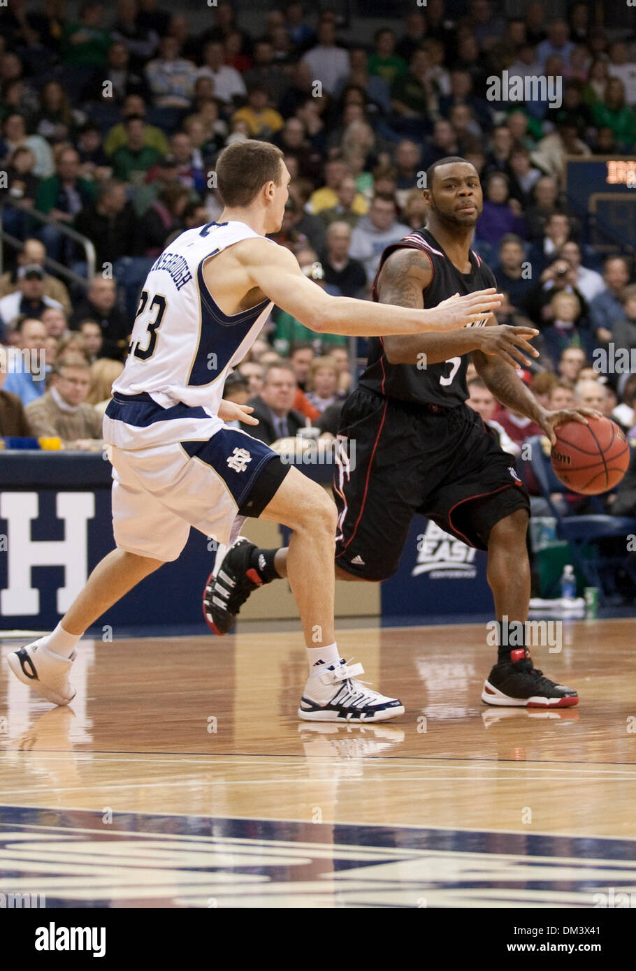Cincinnati Guard Deonta Vaughn (5) and Notre Dame Guard Ben Hansbrough ...