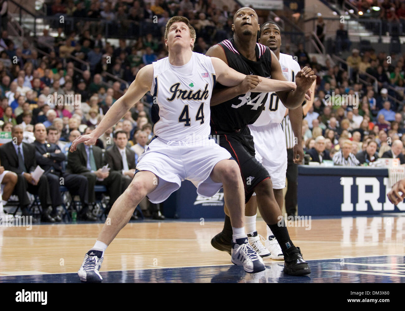 Notre Dame Forward Luke Harangody (44) and Cincinnati Forward Yancy ...
