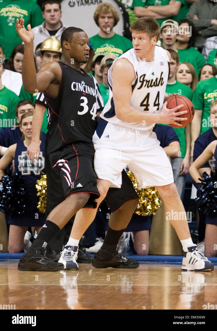 Notre Dame Forward Luke Harangody (44) and Cincinnati Forward Yancy ...