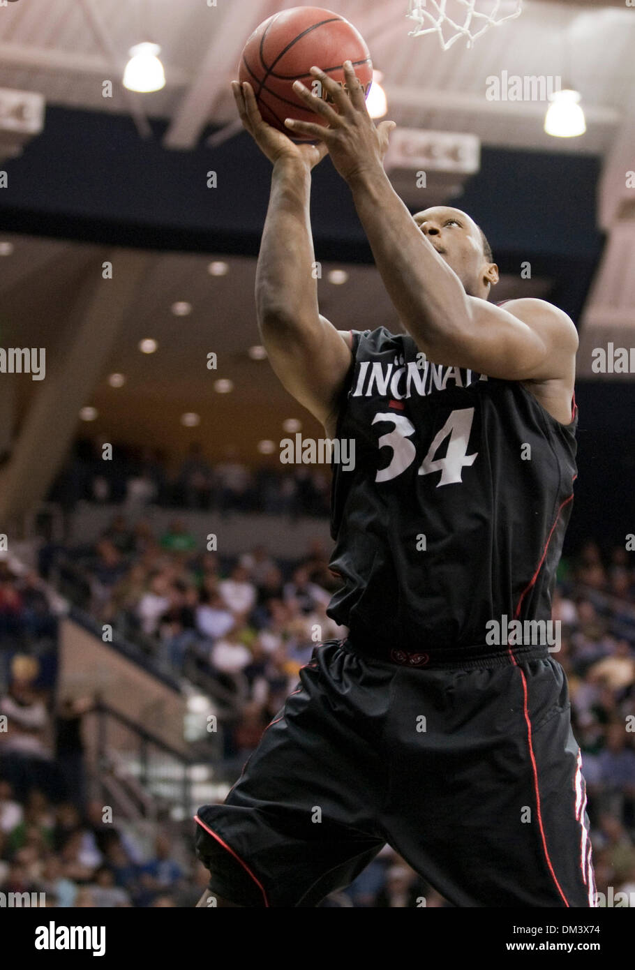 Cincinnati Forward Yancy Gates (34) grabs rebound in first half game ...
