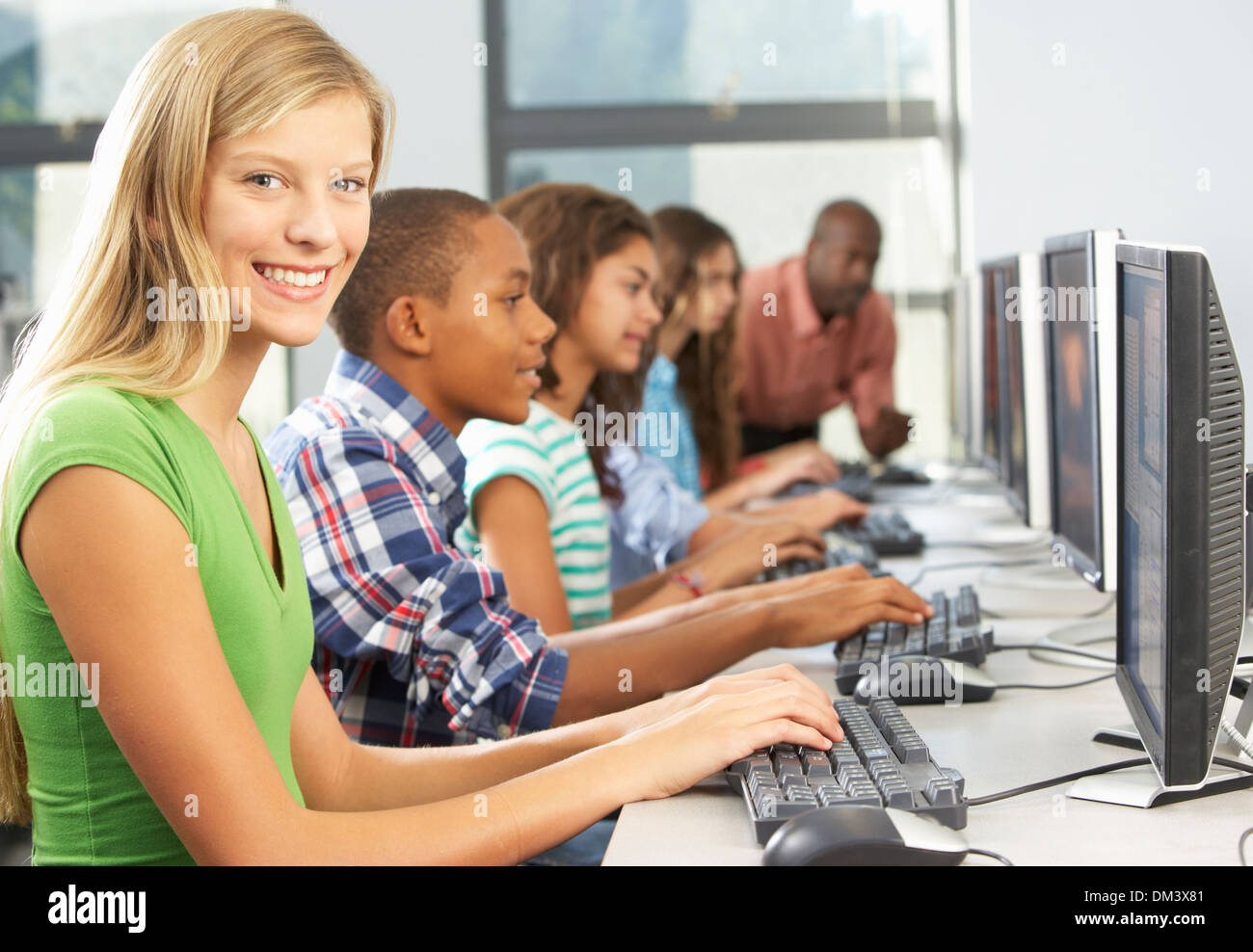 Group Of Students Working At Computers In Classroom Stock Photo - Alamy
