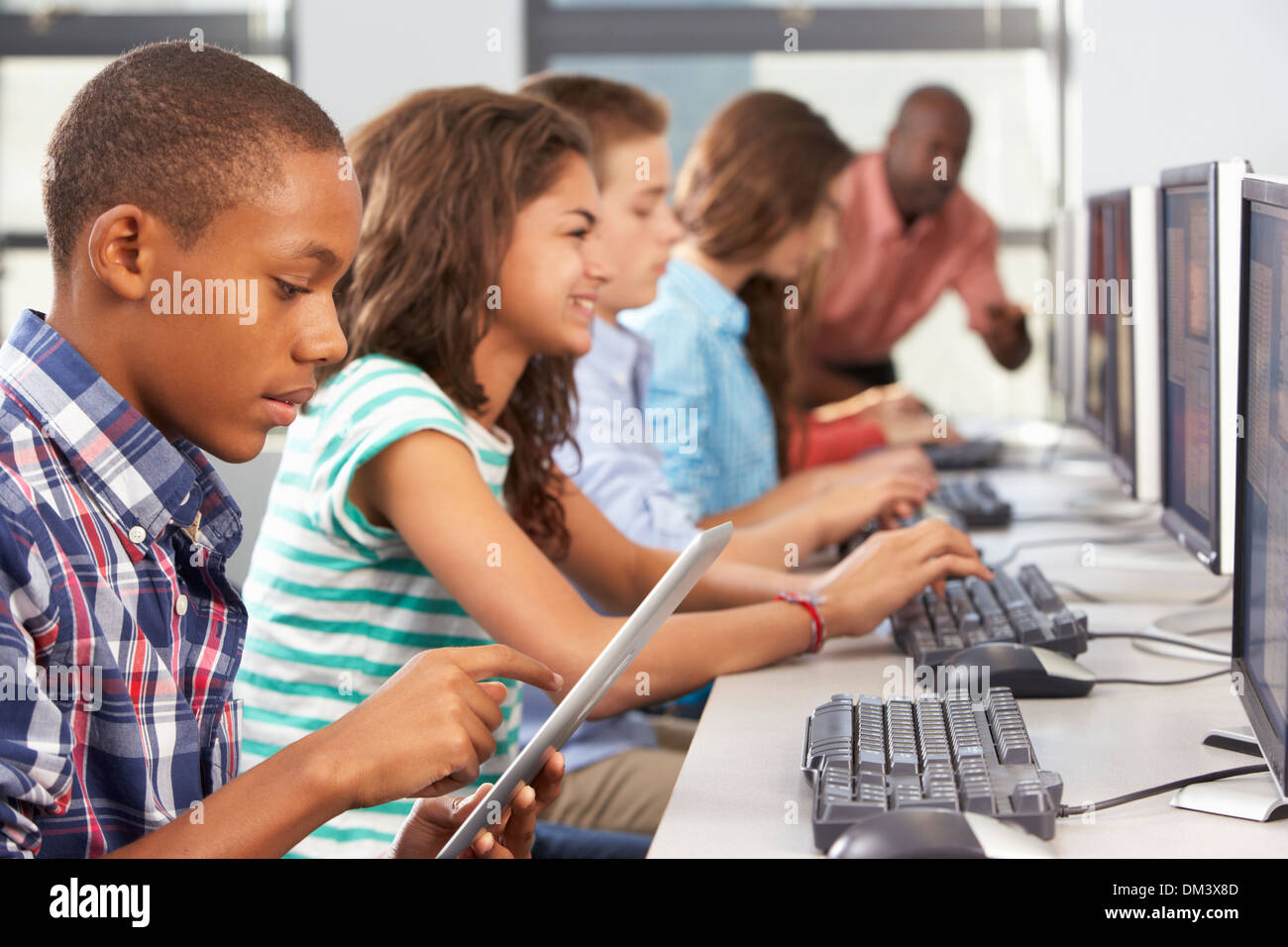 Boy Using Digital Tablet In Computer Class Stock Photo - Alamy