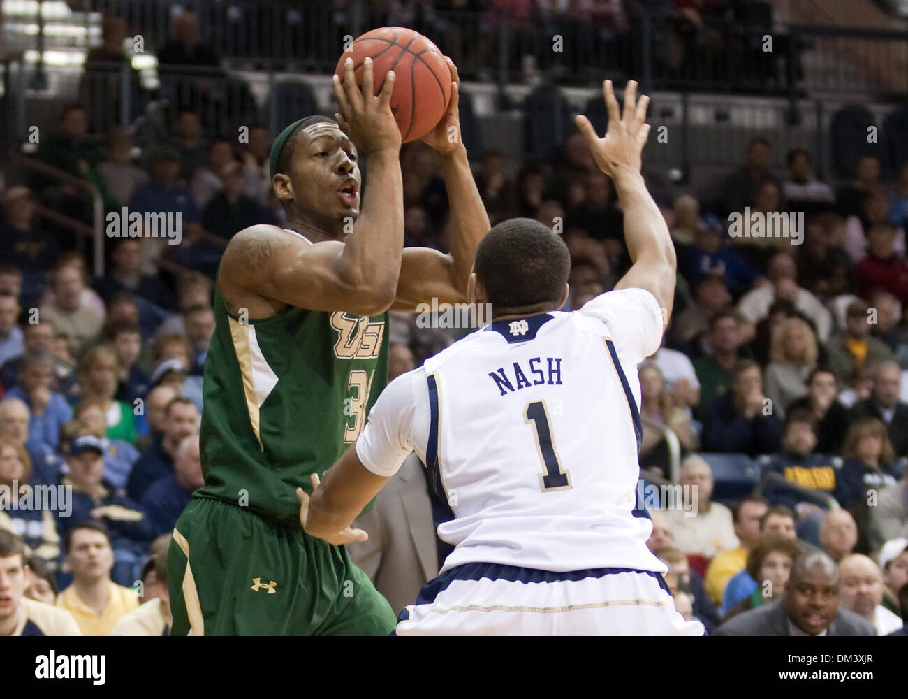 Notre Dame Forward Tyrone Nash (1) defends South Florida Forward Jarrid ...
