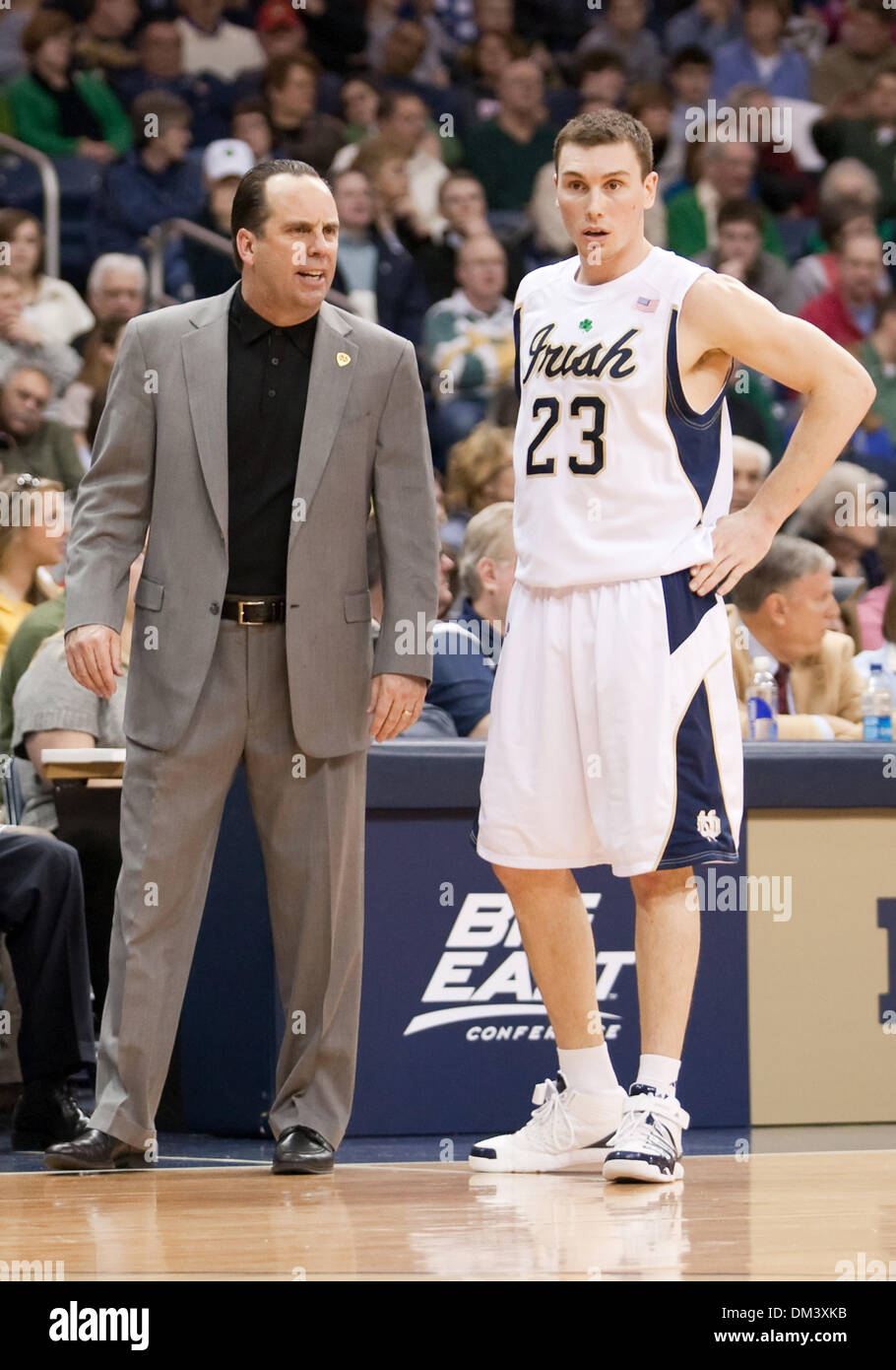 Notre Dame Head Coach Mike Brey talks with Guard Ben Hansbrough (23 ...