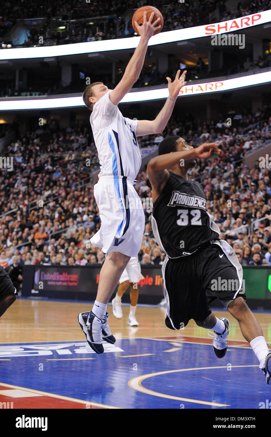Villanova forward Taylor King #31 lays the ball in while being defended ...