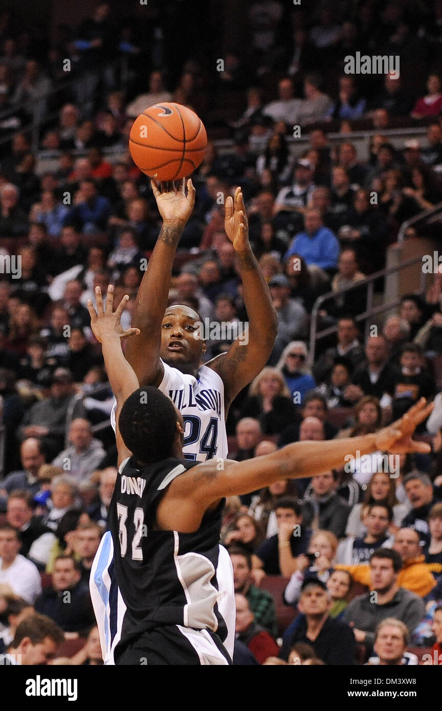 Villanova guard Corey Stokes #24 shoots over Providence guard Vincent ...