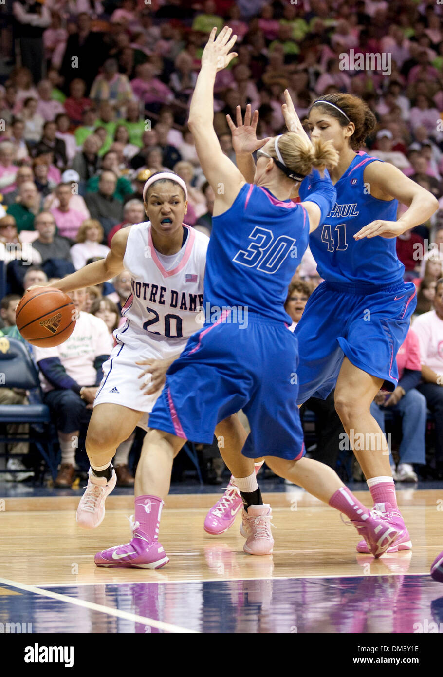 Notre Dame Guard Ashley Barlow (20) drives on DePaul players Jennifer ...