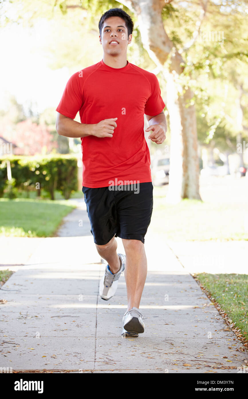 Male runner on pavement hi-res stock photography and images - Alamy